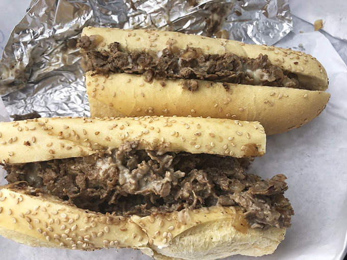 Behold the star attraction – thinly sliced steak and perfectly melted cheese embraced by a sesame-studded roll. Poetry in sandwich form.