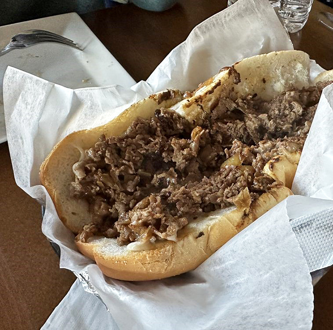 Behold the star of our show: a cheesesteak that doesn't need Philadelphia's permission to be magnificent. Those hand-sliced ribeye bits are doing a happy dance.