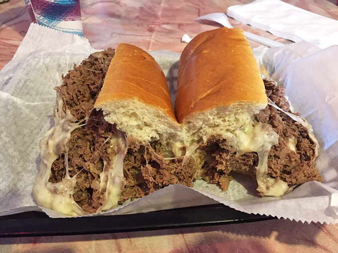 Not so much a sandwich as a structural marvel of meat and cheese. Engineers should study how this roll contains such delicious excess.