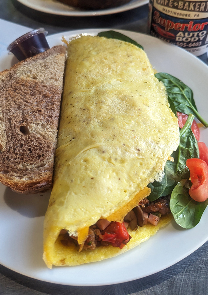 Behold breakfast perfection: a golden omelet bursting with savory steak and veggies, paired with hearty toast. Philadelphia and breakfast had a baby, and it's glorious.