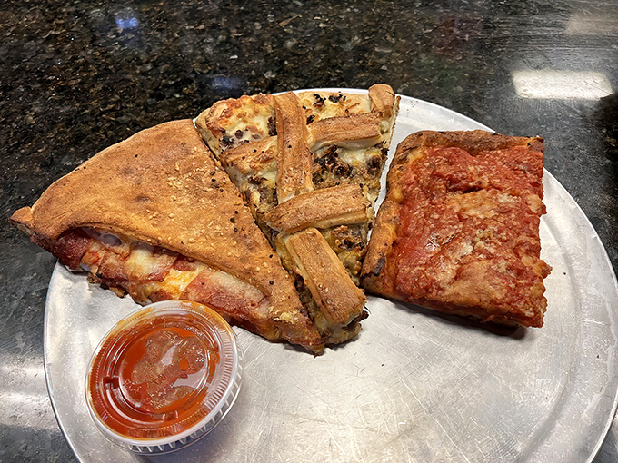 The holy trinity of Pizza Boy's culinary creativity: calzone, stromboli, and Sicilian square. This plate is what happens when dough dreams big.