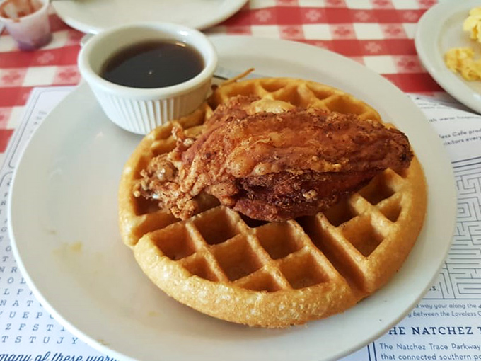 The star attraction: a golden waffle crowned with perfectly fried chicken. Heaven doesn't need pearly gates when it has crispy batter.
