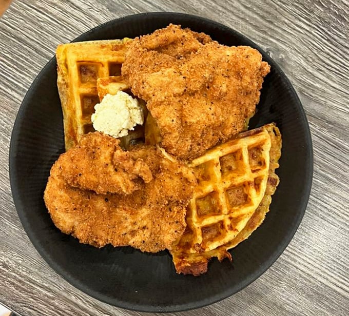 Golden waffles cradle perfectly crispy fried chicken in this Southern masterpiece. It's the kind of plate that makes you want to write thank-you notes to the chef.