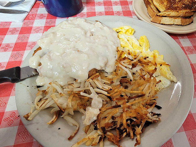 Behold the holy grail of comfort food: chicken fried steak smothered in gravy with crispy hash browns and scrambled eggs. Diet starts tomorrow.