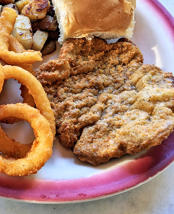 The chicken fried steak doesn't just sit on the plate&mdash;it commands attention with a golden crust that crackles with each fork pierce.