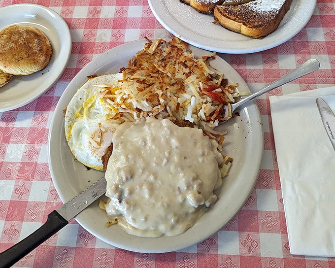 Breakfast nirvana achieved: crispy hash browns, country gravy that could make a vegetarian reconsider, and an egg for good measure. The breakfast trifecta.