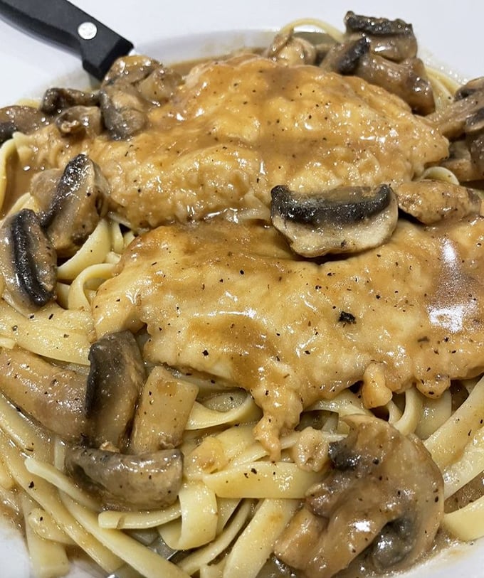 Behold the star attraction&mdash;Chicken Marsala that doesn't just sit on the plate, it performs. Those mushrooms aren't garnish, they're co-headliners.