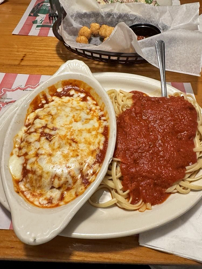Behold: chicken Parmesan that could make angels weep. That melted cheese pulls like a heartstring, while the pasta waits patiently for its tomato bath.