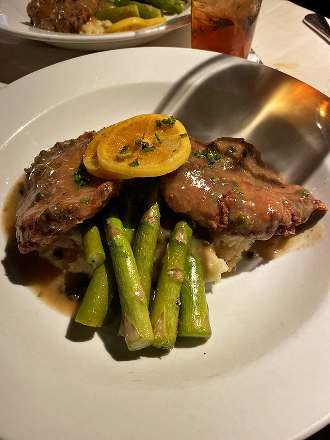 The legendary chicken piccata that launched a thousand road trips. Golden cutlets bathed in that perfect lemon-butter-caper sauce that dreams are made of.