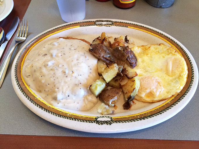 Breakfast nirvana: eggs sunny-side up, potatoes with perfect crispy edges, and that gravy&mdash;oh that gravy&mdash;blanketing everything in peppery bliss.