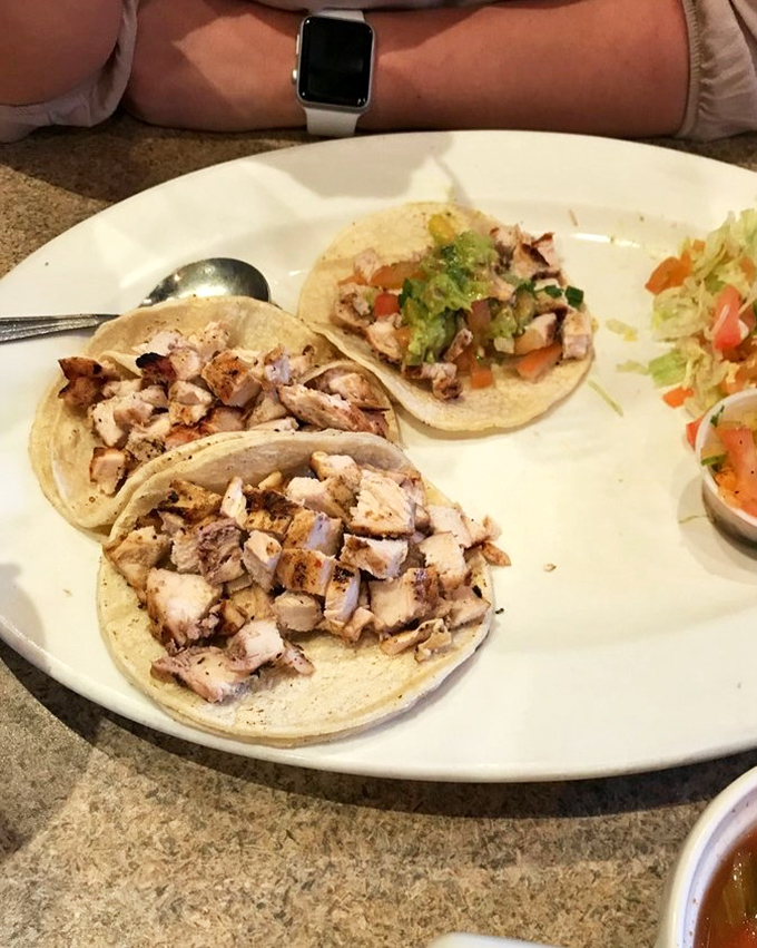 These chicken tacos aren't just a meal—they're tiny flavor festivals where perfectly seasoned meat meets fresh toppings in corn tortilla harmony.