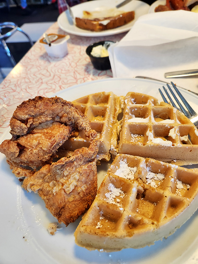 Chicken and waffles: where crispy, savory poultry meets sweet, fluffy grids in a romance more compelling than any Hollywood blockbuster.