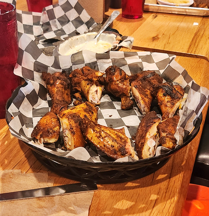 These smoked wings aren't just cooked, they're transformed. The deep mahogany bark on each piece hints at the flavor explosion waiting inside.
