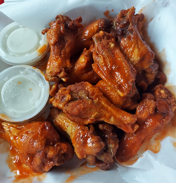 These wings aren't just food; they're a religious experience. Glistening with sauce and ready to transport you to chicken wing nirvana.