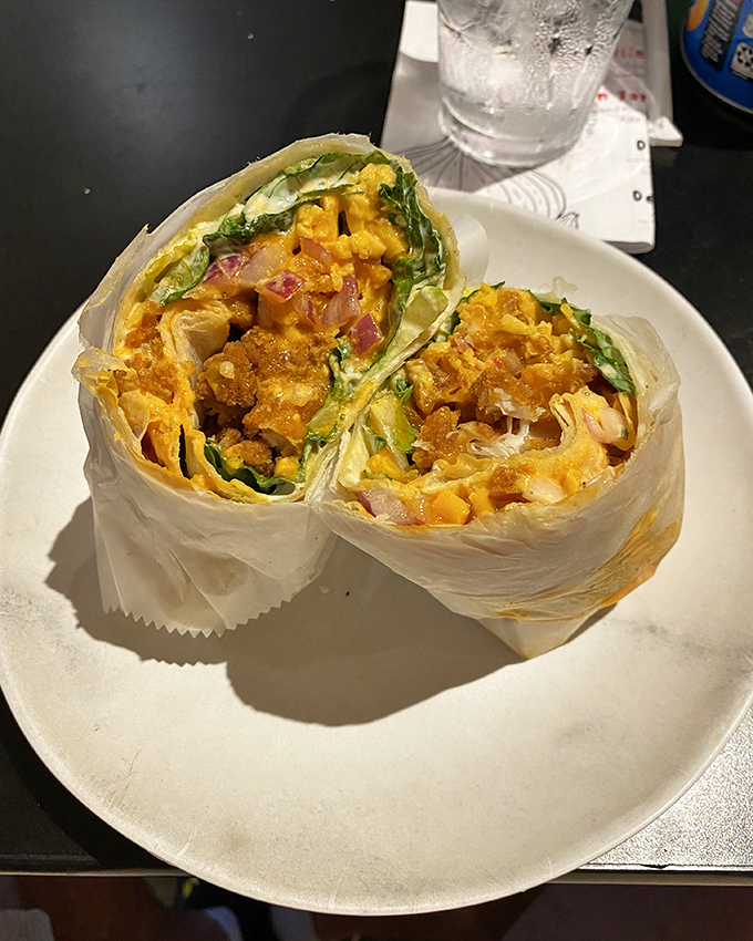Behold the legendary Clucker wrap in all its glory! Golden fried chicken, fresh veggies, and cheese create a handheld masterpiece that justifies the drive to McConnellsburg.