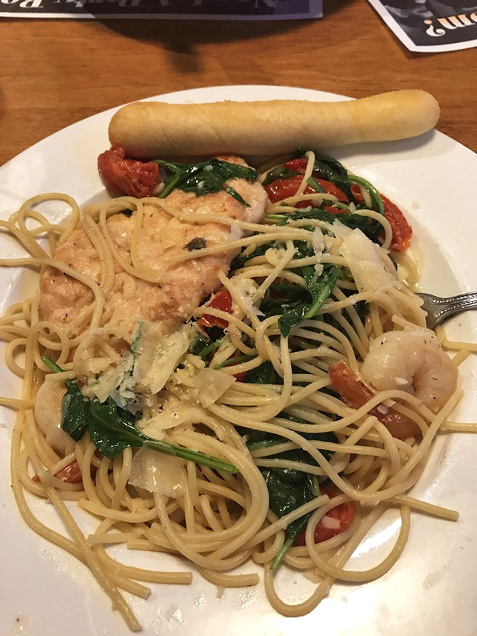The star of the show: Chicken and Shrimp Scampi that would make Neptune himself swim upstream. Plump shrimp, tender chicken, and pasta that's found its life purpose.
