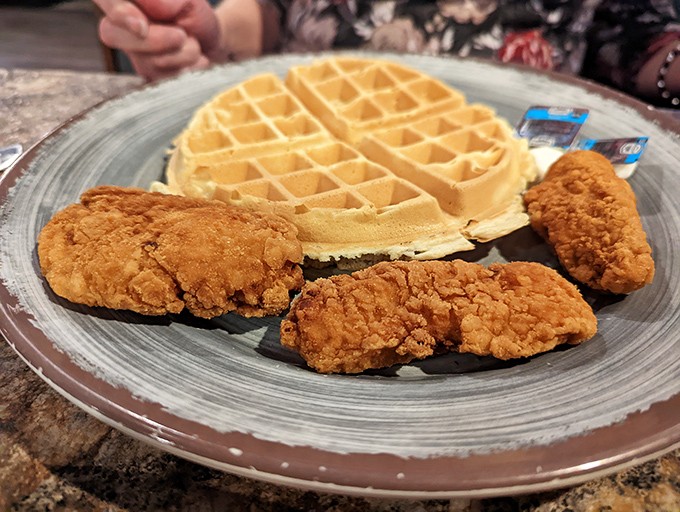 Chicken and waffles: where breakfast and dinner collide in a magnificent display of culinary democracy. The crispy coating alone deserves its own fan club.
