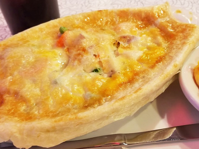 The legendary chicken pot pie in all its golden-crusted glory. This isn't just comfort food&mdash;it's a warm hug from your grandmother in edible form.