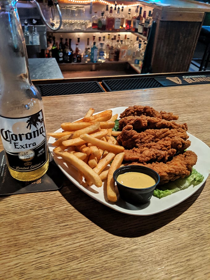 Golden-fried chicken tenders that crunch like autumn leaves, paired with perfectly crisp fries. The Corona is just there to wash down the guilt.