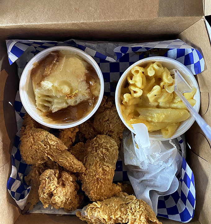 Golden-brown wings nestled alongside mac and cheese and a honey biscuit. This isn't just takeout; it's edible artwork.