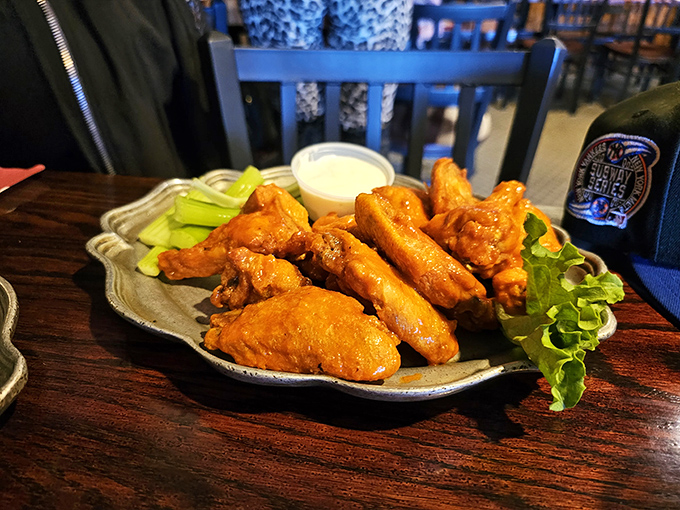 These wings aren't just taking flight&mdash;they're soaring to flavor heaven. Crispy, saucy perfection served with the obligatory celery nobody actually eats.