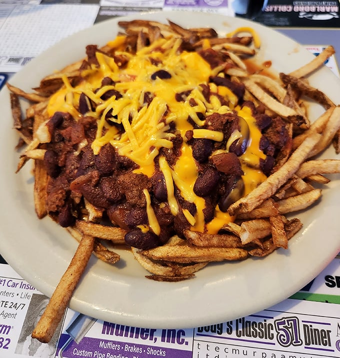 Behold the holy grail of comfort food: chili cheese fries that could make a cardiologist weep and a food lover sing hallelujah.