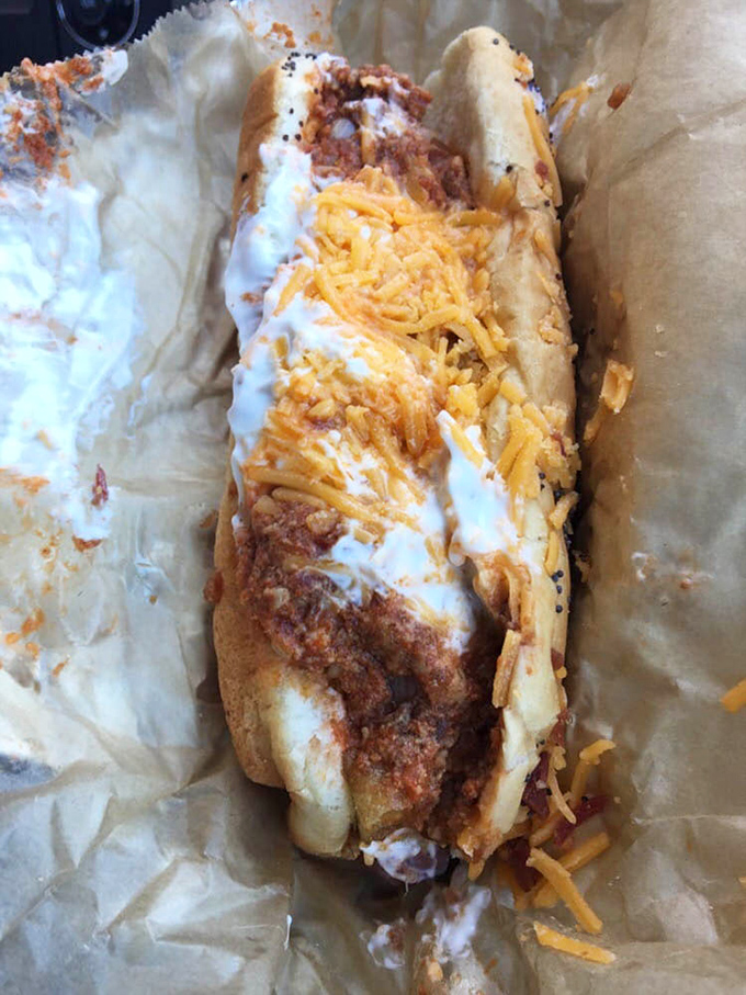 This isn't just a chili cheese dog; it's a masterpiece of melty indulgence that requires both napkins and a moment of silent appreciation.