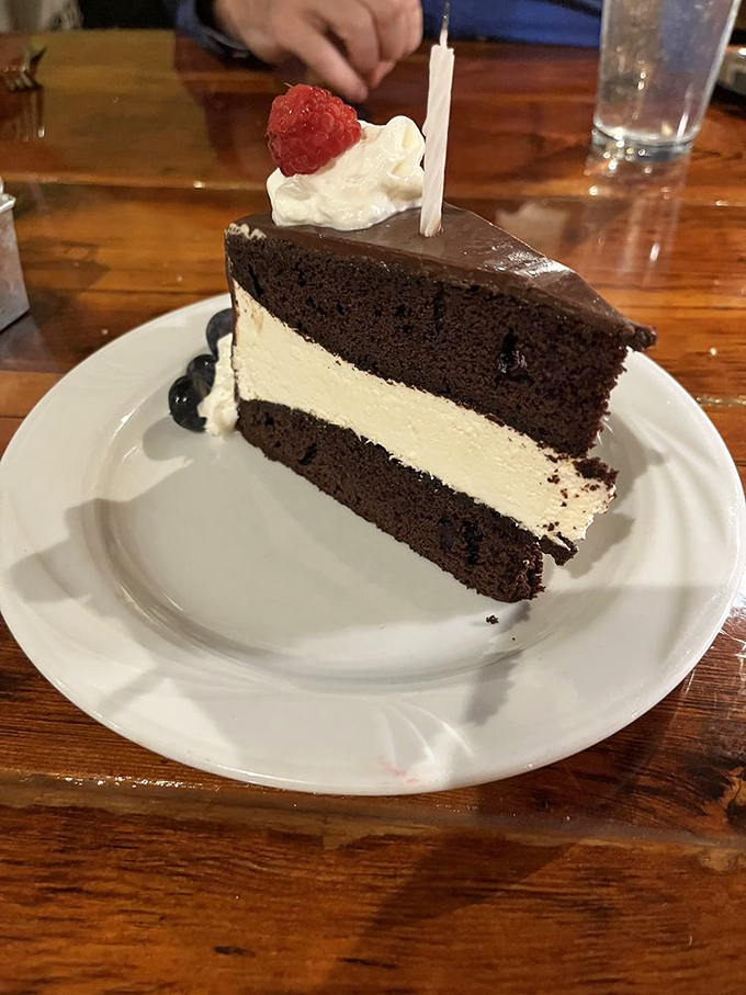 The legendary chocolate cake that launches road trips. That cream layer isn't just filling&mdash;it's the reason GPS systems across Ohio are set to "La Tavola."