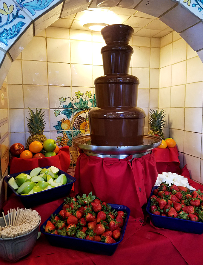 Not just any chocolate fountain, but a cascading masterpiece surrounded by fresh fruit&mdash;nature's way of pretending dessert is healthy.