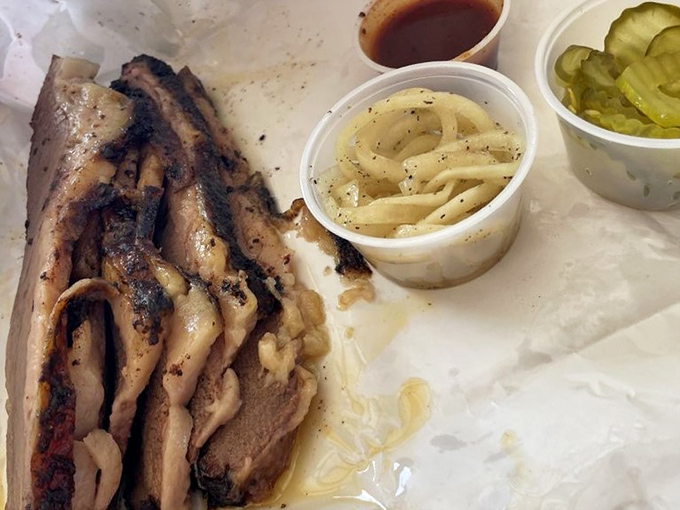 Behold the star of the show: tender brisket with that coveted smoke ring, accompanied by onions and pickles&mdash;Texas' holy trinity.
