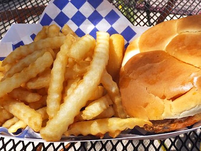 Golden fries and a perfectly toasted bun&mdash;roadside dining elevated to an art form without any pretension. Pure American poetry on a plate.