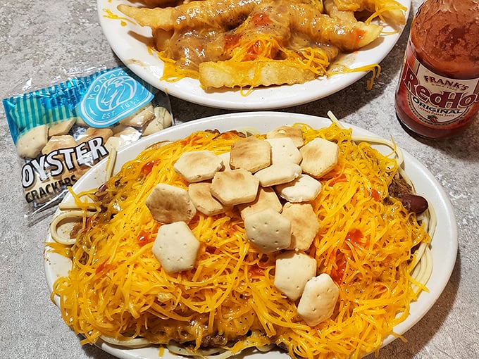 Behold the golden mountain of cheese-covered glory that makes cardiologists nervous and taste buds sing.