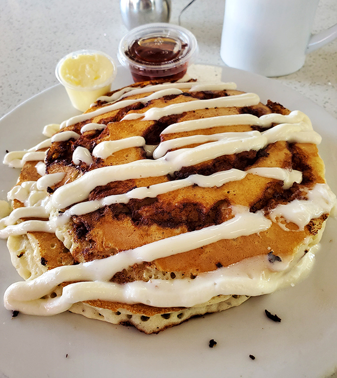 Cinnamon Roll Pancakes that make you question why all pancakes don't come dressed in swirls of cinnamon and cream cheese icing.