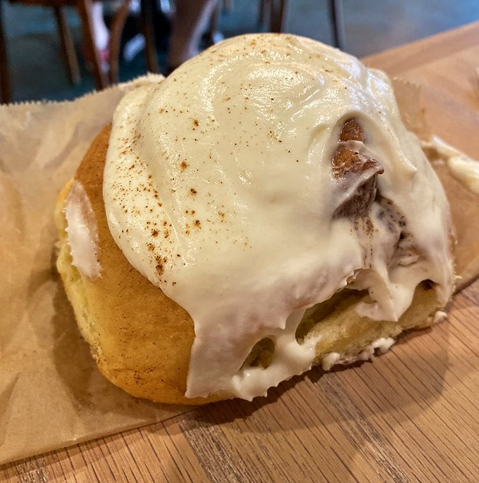 The cinnamon roll that launched a thousand road trips. That cream cheese frosting melts slower than your resolve to "just have a bite."