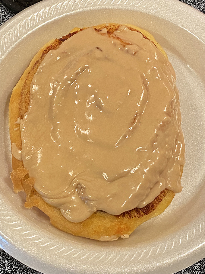 The legendary cinnamon roll, crowned with a melting halo of cream cheese frosting. Worth every calorie and possibly a minor religious experience.