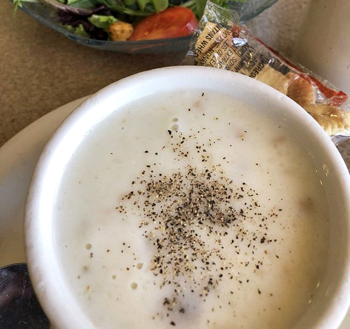 This isn't just clam chowder; it's a creamy bowl of coastal comfort that makes you understand why people drive hours just for a spoonful.