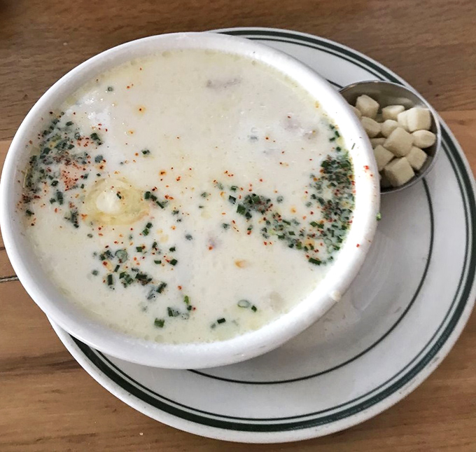 The legendary New England clam chowder arrives like a creamy cloud dotted with tender clams and herbs&mdash;comfort in a bowl that's worth crossing state lines for.