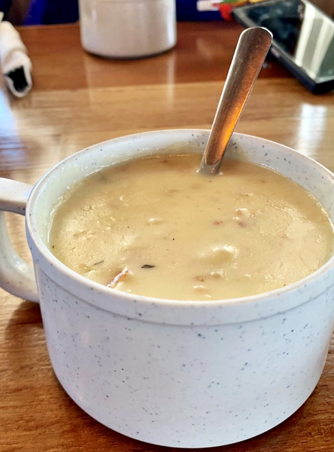 Liquid gold in a speckled mug. This clam chowder isn't just a soup&mdash;it's a creamy ocean hug that makes you wonder why you'd eat it any other way.