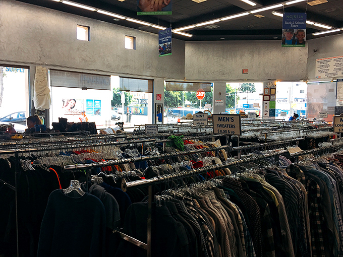 Rows of clothing stretch endlessly, each garment whispering stories of fashion eras gone by but not forgotten. 