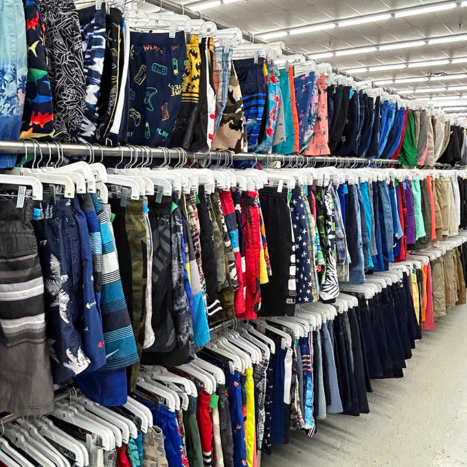 A tidal wave of colorful shorts floods the racks, waiting to be scooped up by bargain hunters and sun-chasers alike.