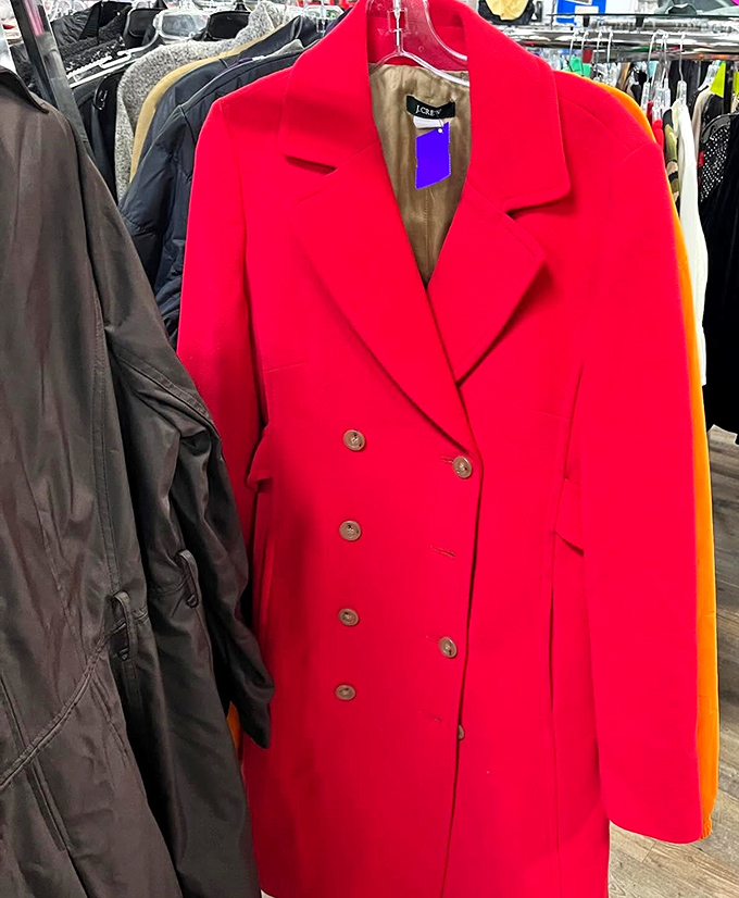 That eye-catching red coat isn't just making a statement&mdash;it's delivering a full-blown fashion TED talk among its more subdued neighbors.