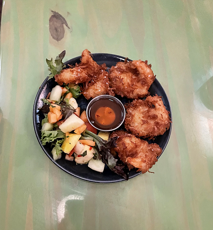 Golden perfection meets tropical paradise - these coconut shrimp could make a grown person weep tears of joy.