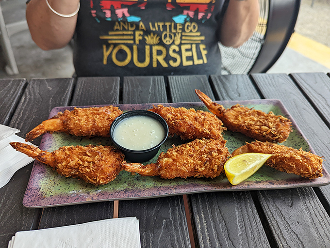 Golden coconut shrimp that crunch like nature's perfect contradiction&mdash;tropical sweetness meets savory satisfaction with every bite.