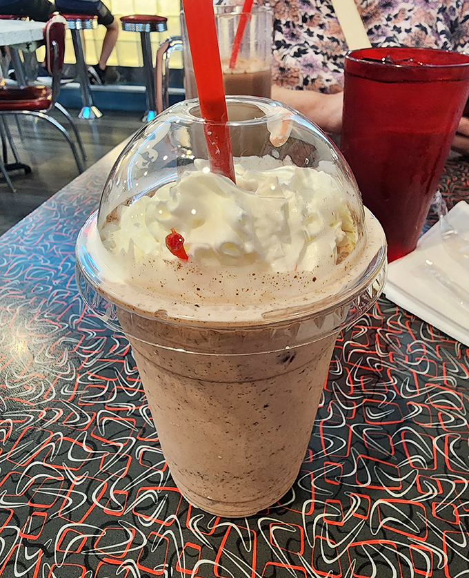 The legendary coffee milkshake arrives with whipped cream mountain and cherry summit. One sip and you'll understand why people drive miles for this creamy masterpiece.