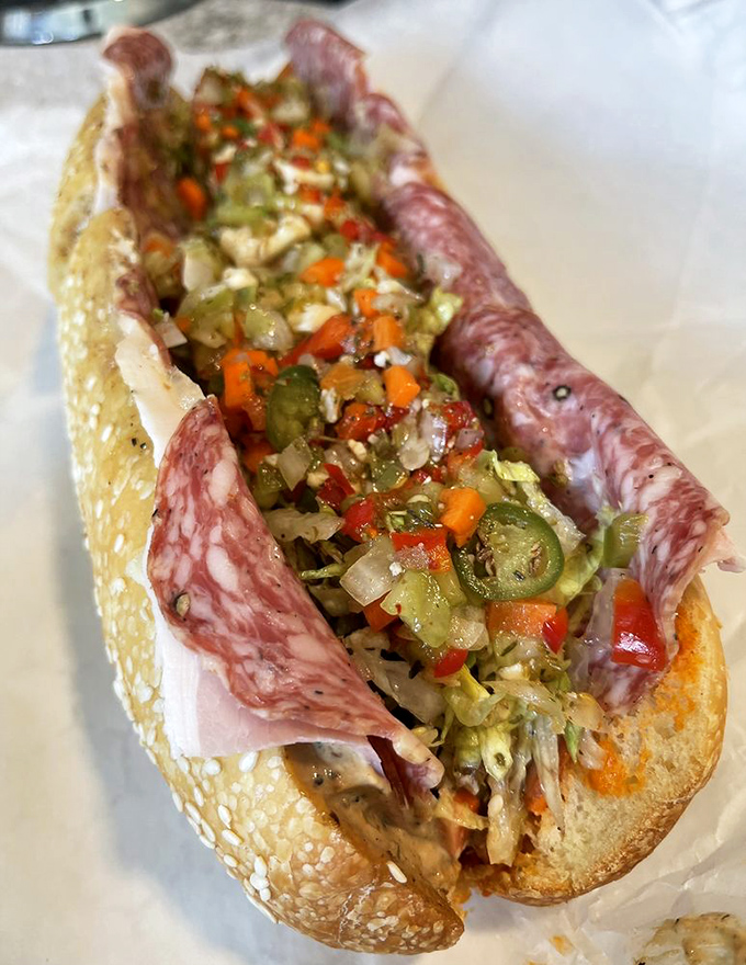 The Cold Cut isn't just a sandwich—it's an architectural marvel of Italian meats, house giardiniera, and that signature Wario sauce that ties everything together.