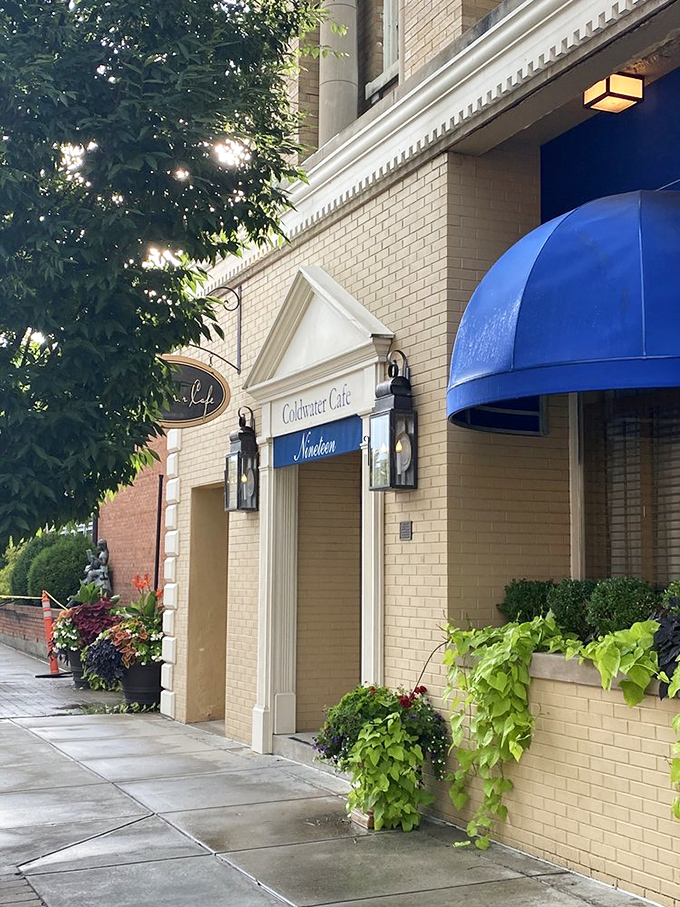 Coldwater Caf&eacute;'s elegant entrance promises culinary delights within. The cascading greenery adds a touch of nature to this downtown gem.