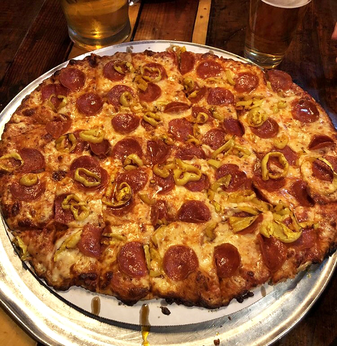 Behold Columbus-style pizza in all its golden glory, where crust meets toppings in perfect harmony.