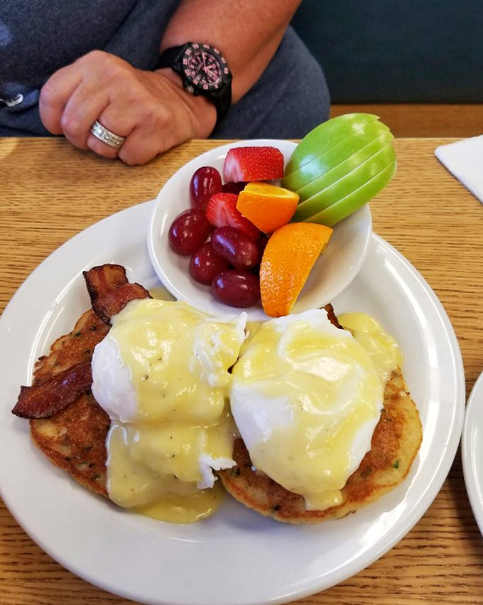 Eggs Benedict gets a Southern makeover with cornmeal cakes. That hollandaise sauce is practically doing the Charleston on those perfectly poached eggs.