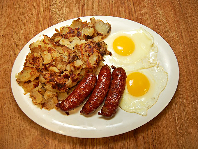 Sunny-side up eggs, crispy hash browns, and sausages with the perfect snap &ndash; breakfast doesn't need to wear a tuxedo to be magnificent.