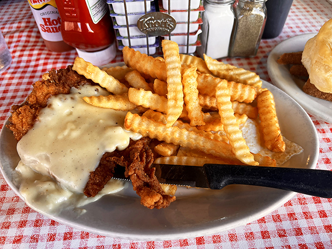 Country fried steak that's crispy, tender, and swimming in gravy so good you'll want to bottle it. Those crinkle-cut fries aren't just sidekicks.